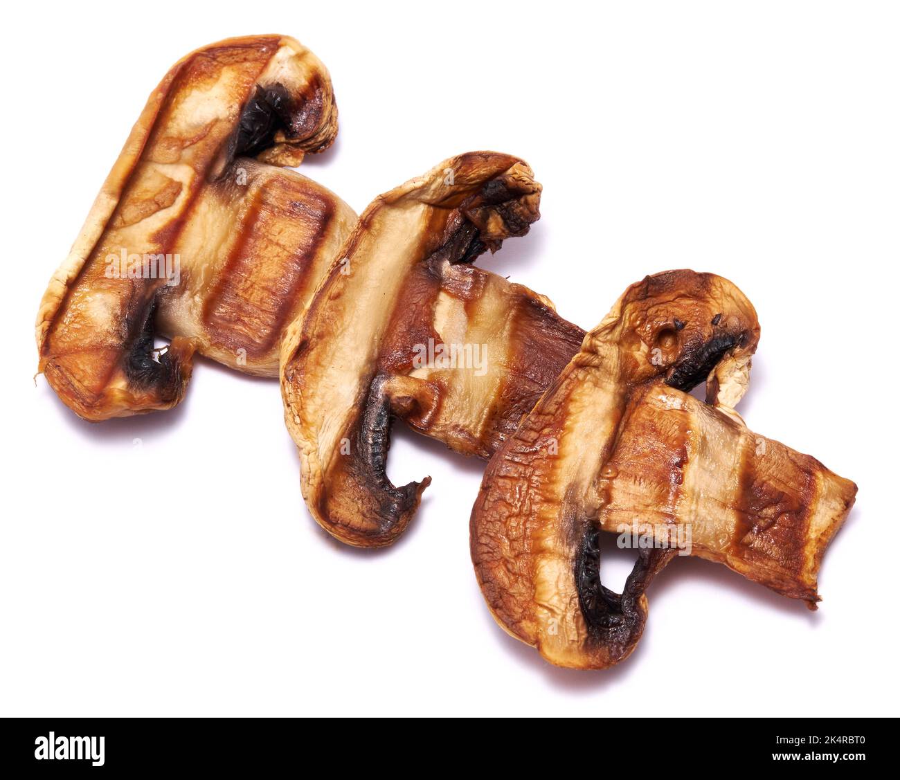 Grilled Slices of champignon mushrooms with stripes from a grill ...
