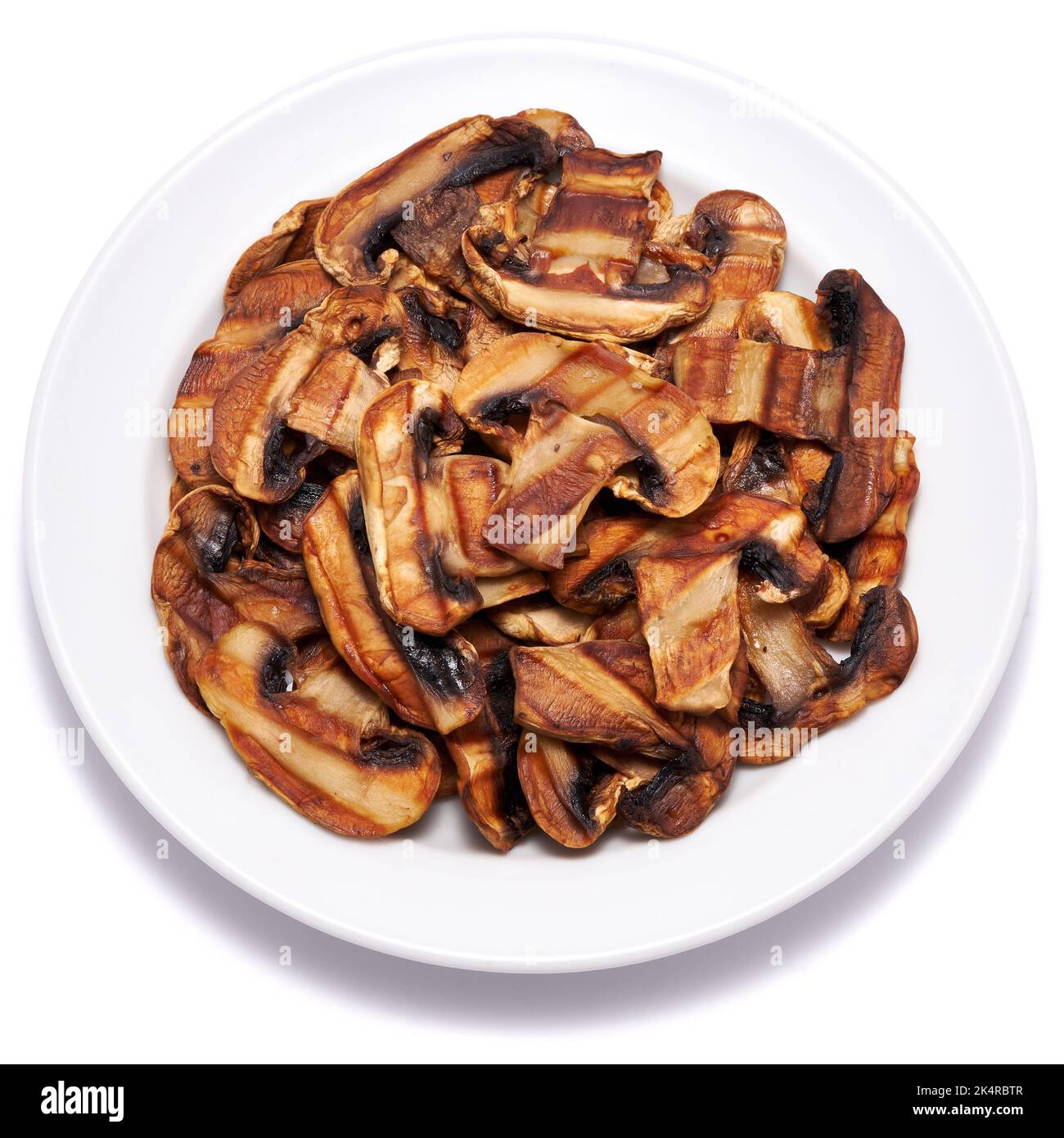 Grilled Slices of champignon mushrooms with stripes from a grill in ...