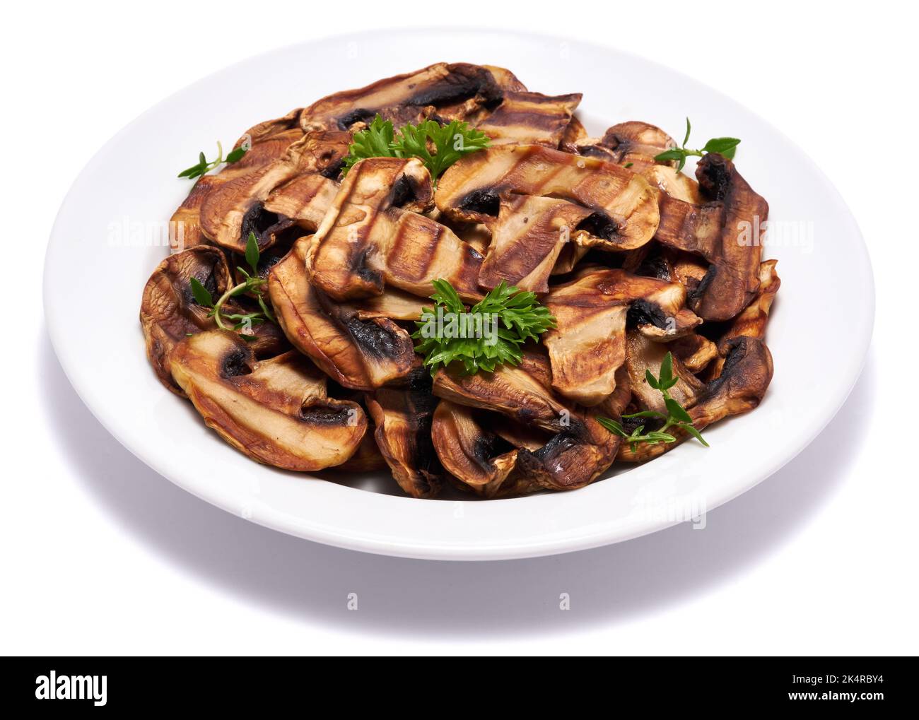 Grilled Slices of champignon mushrooms with stripes from a grill in ...