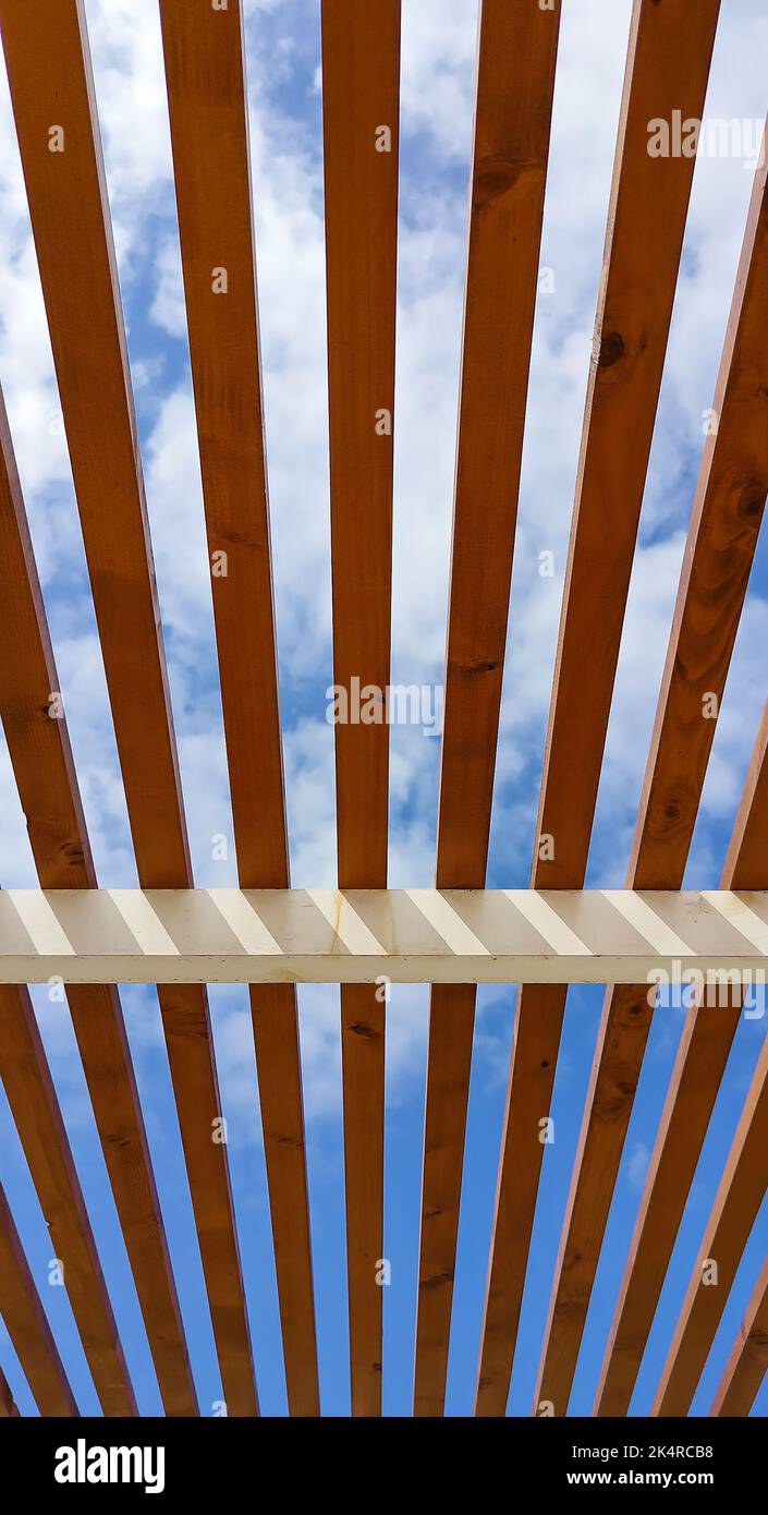 Blue sky through the wooden beams of the canopy roof on the beach Stock ...