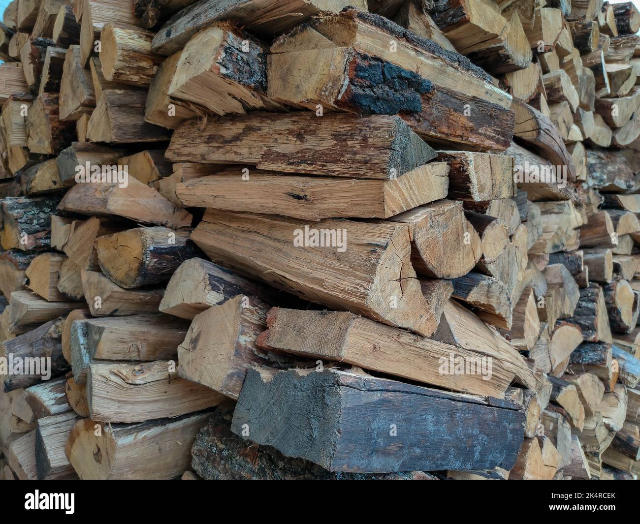 Chopped firewood stacked. Finely chopped and stacked firewood ...