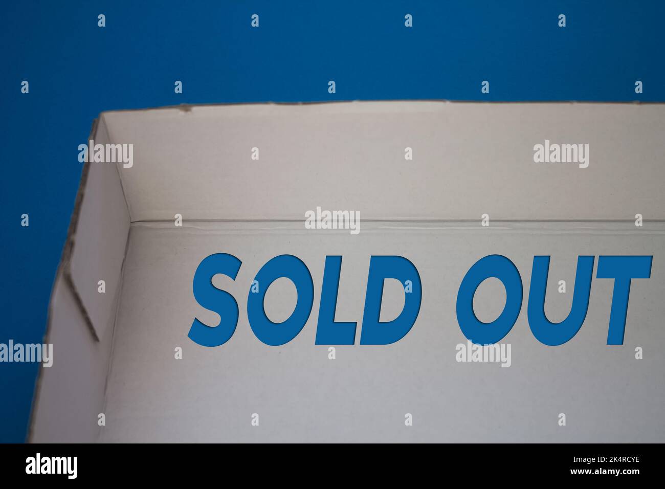 Sold Out word with cardboard box. Brown folded card box Stock Photo - Alamy