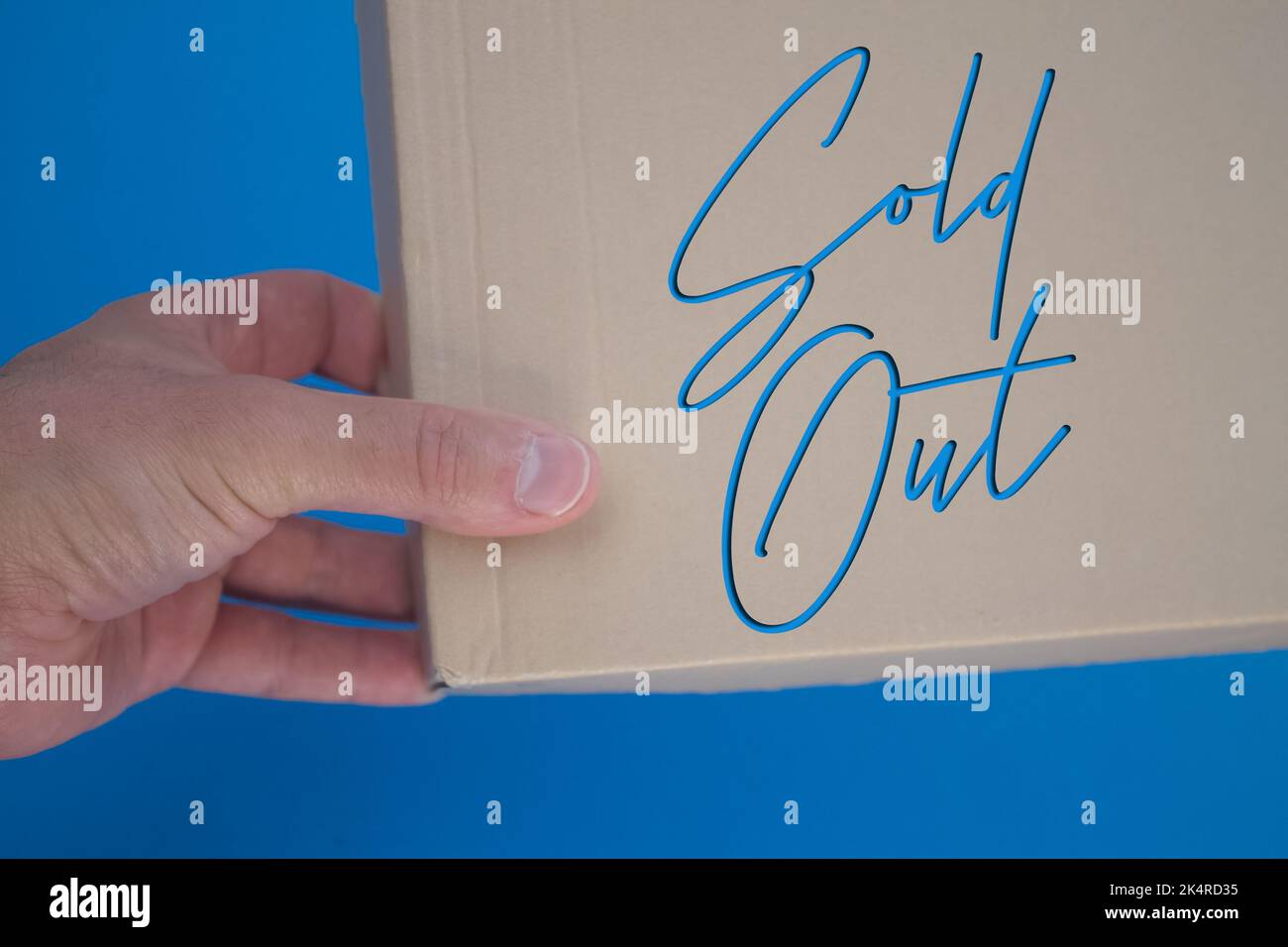Sold Out word with cardboard box. Brown folded card box Stock Photo - Alamy