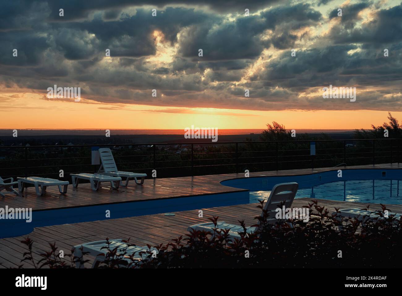 Big swimming outdoor pool in the valley with lounges and chairs. Resort ...