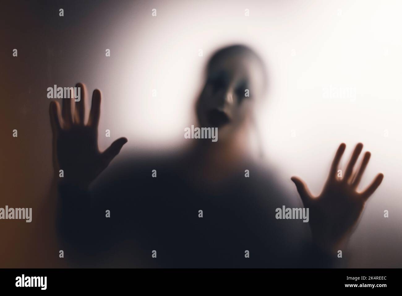Horror ghost woman behind the matte glass. Halloween festival concept ...