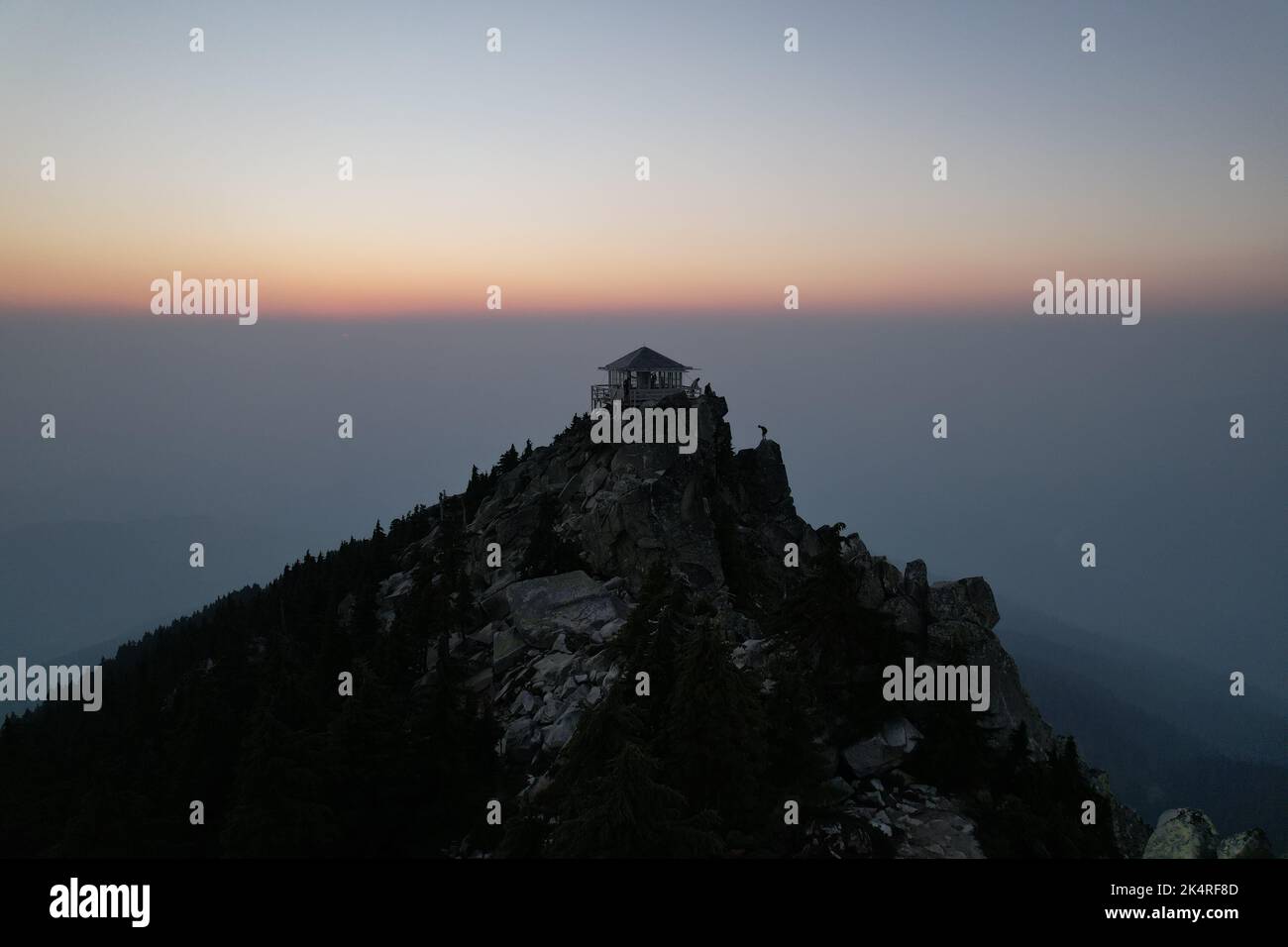 The Mount Pilchuck Lookout Tower against dusk sky in Washington State ...