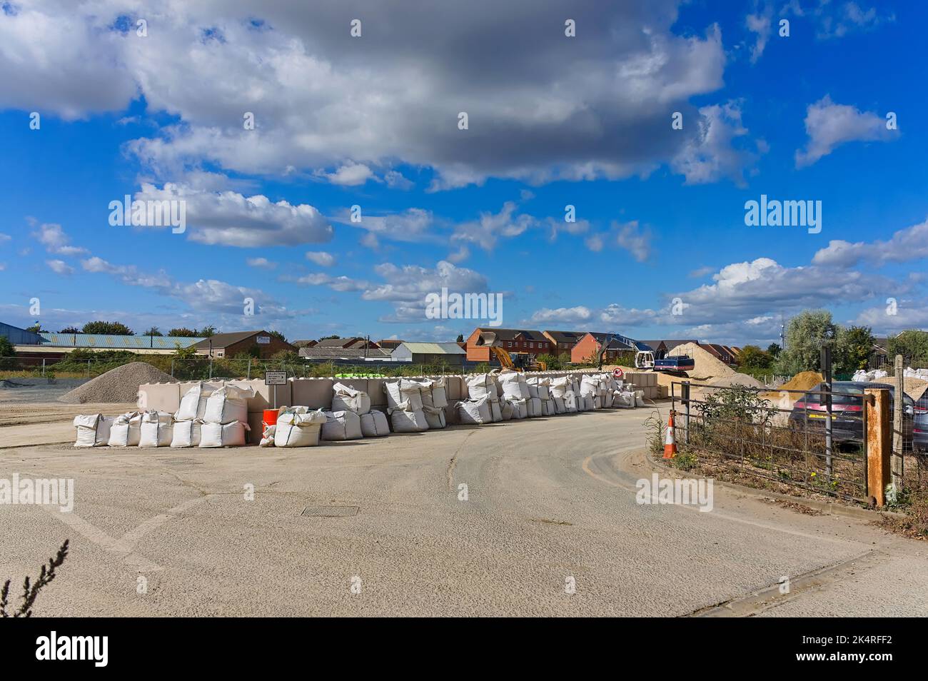 Bags and piles of construction supplies at a building depot off the ...