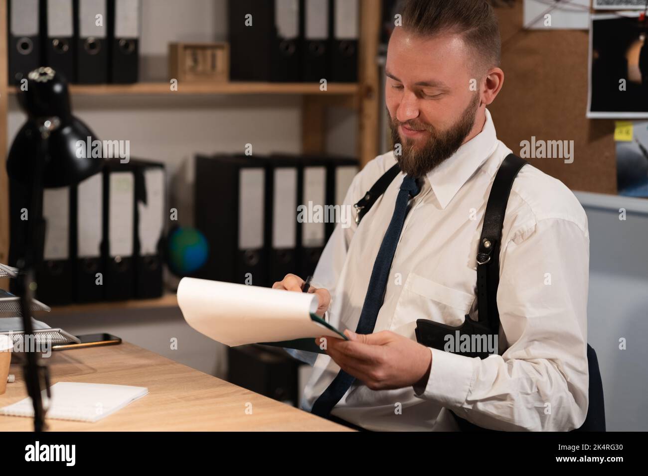 Professional detective working documents hi-res stock photography and ...