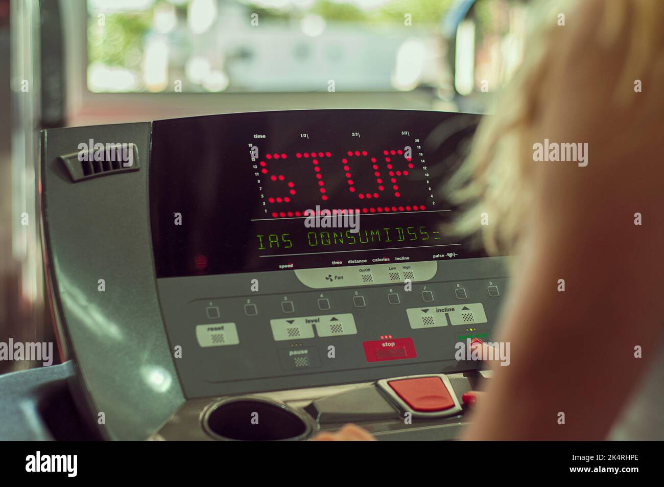Woman using her hands on a treadmill board at the gym. Clear light ...