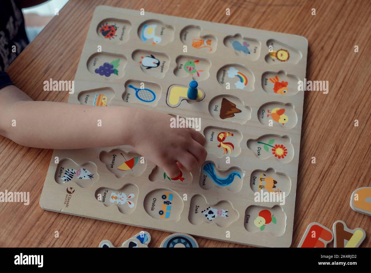 Child playing board game on steel Stock Photo - Alamy