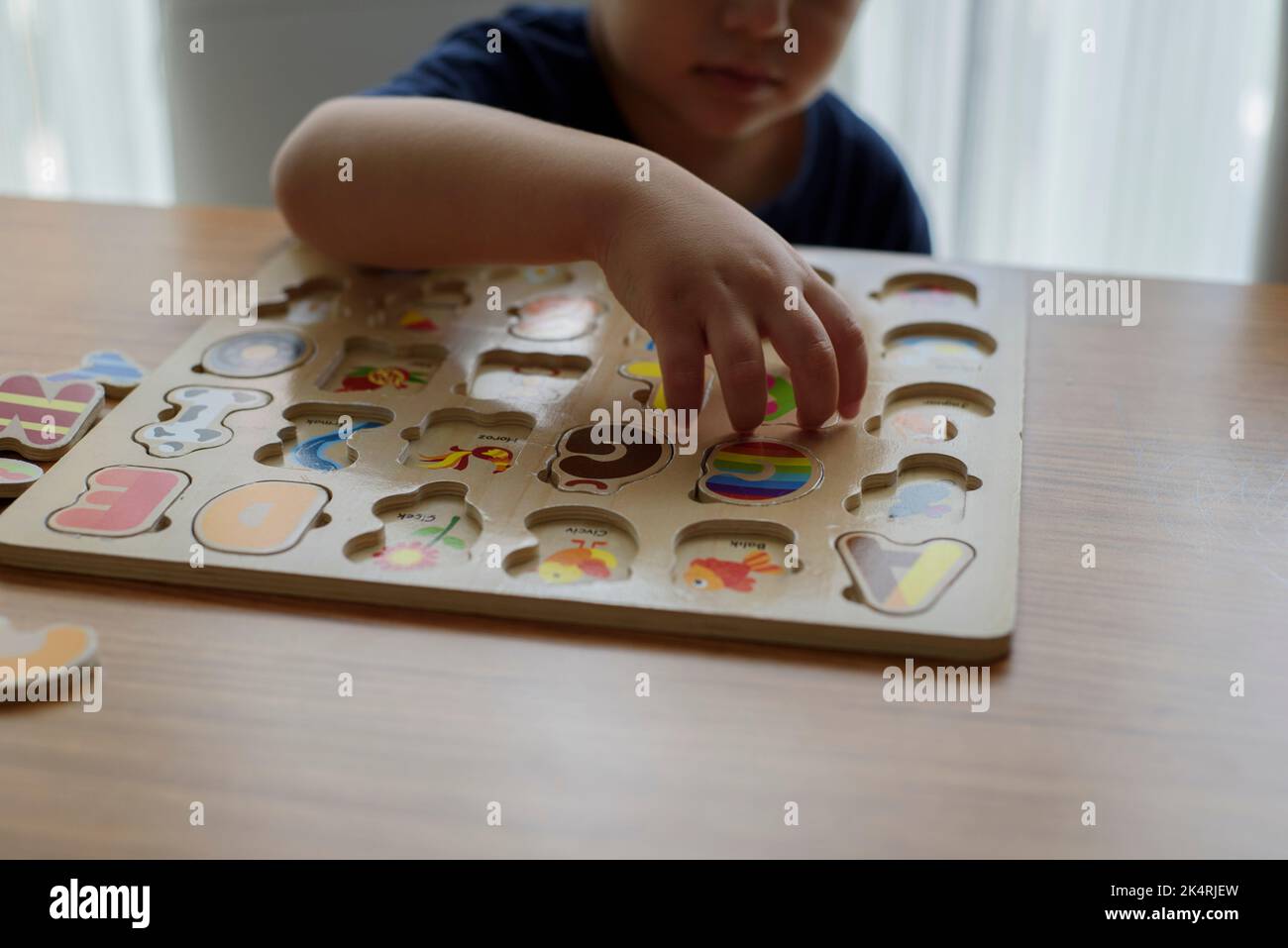 Child playing board game on steel Stock Photo - Alamy