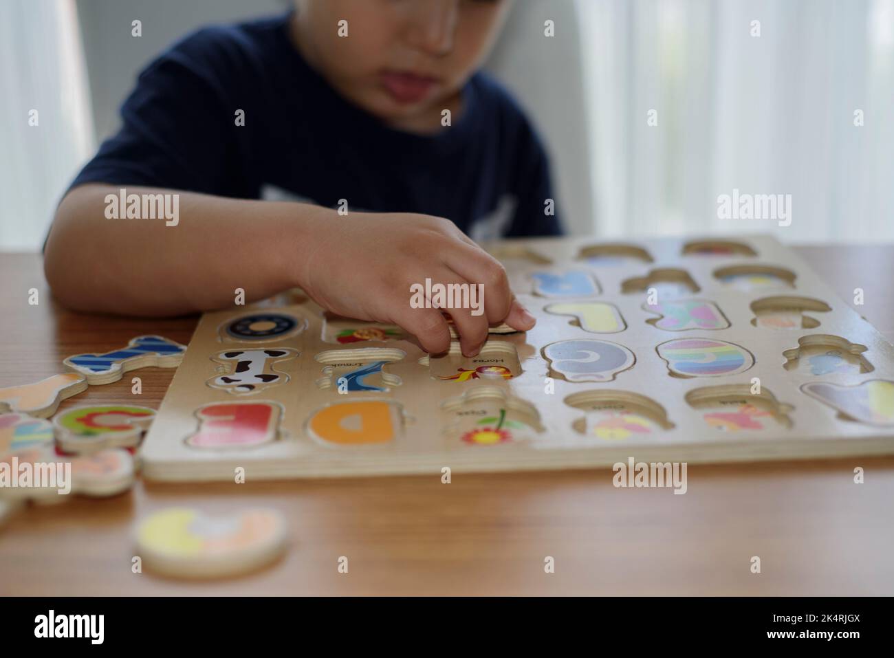 Child playing board game on steel Stock Photo - Alamy