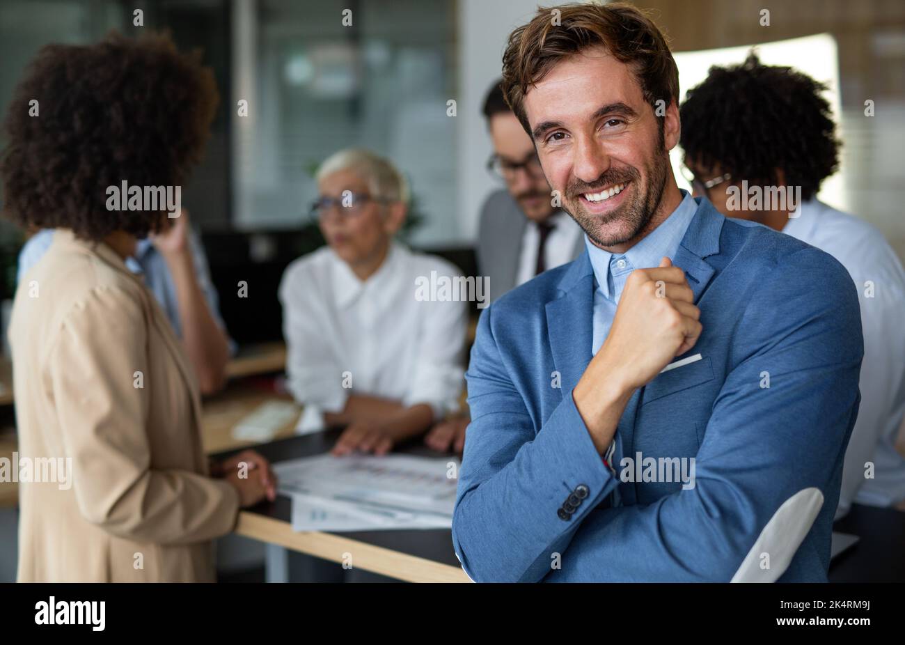 Portrait of young successful ceo businessman smiling in corporate ...