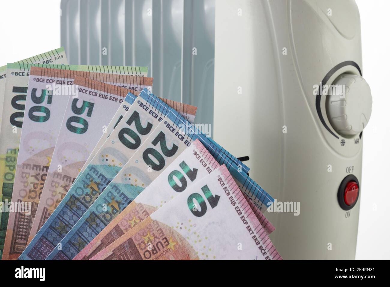 Euro money banknotes on heating radiator battery. Concept of expensive ...