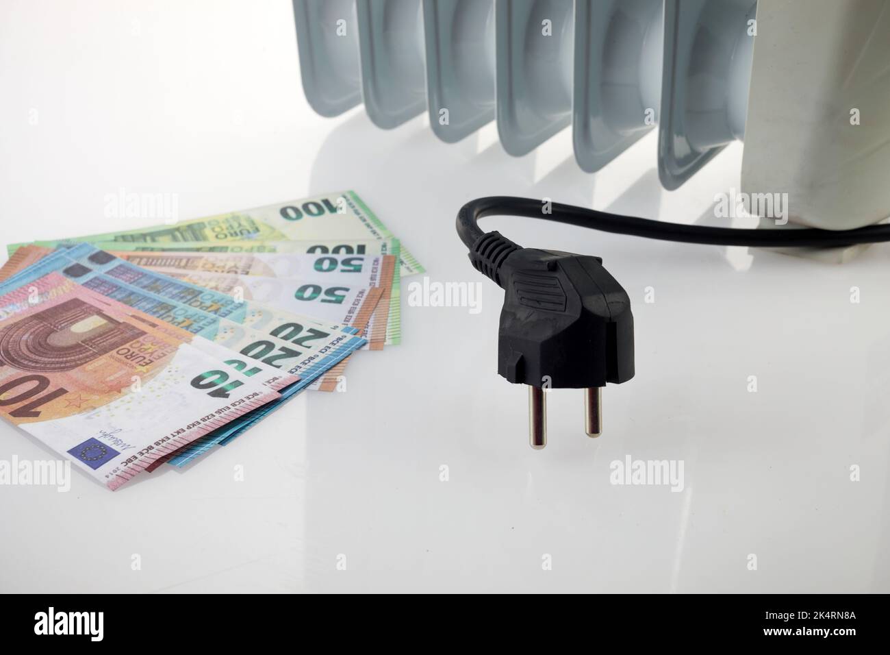 Euro money banknotes on heating radiator battery. Concept of expensive ...
