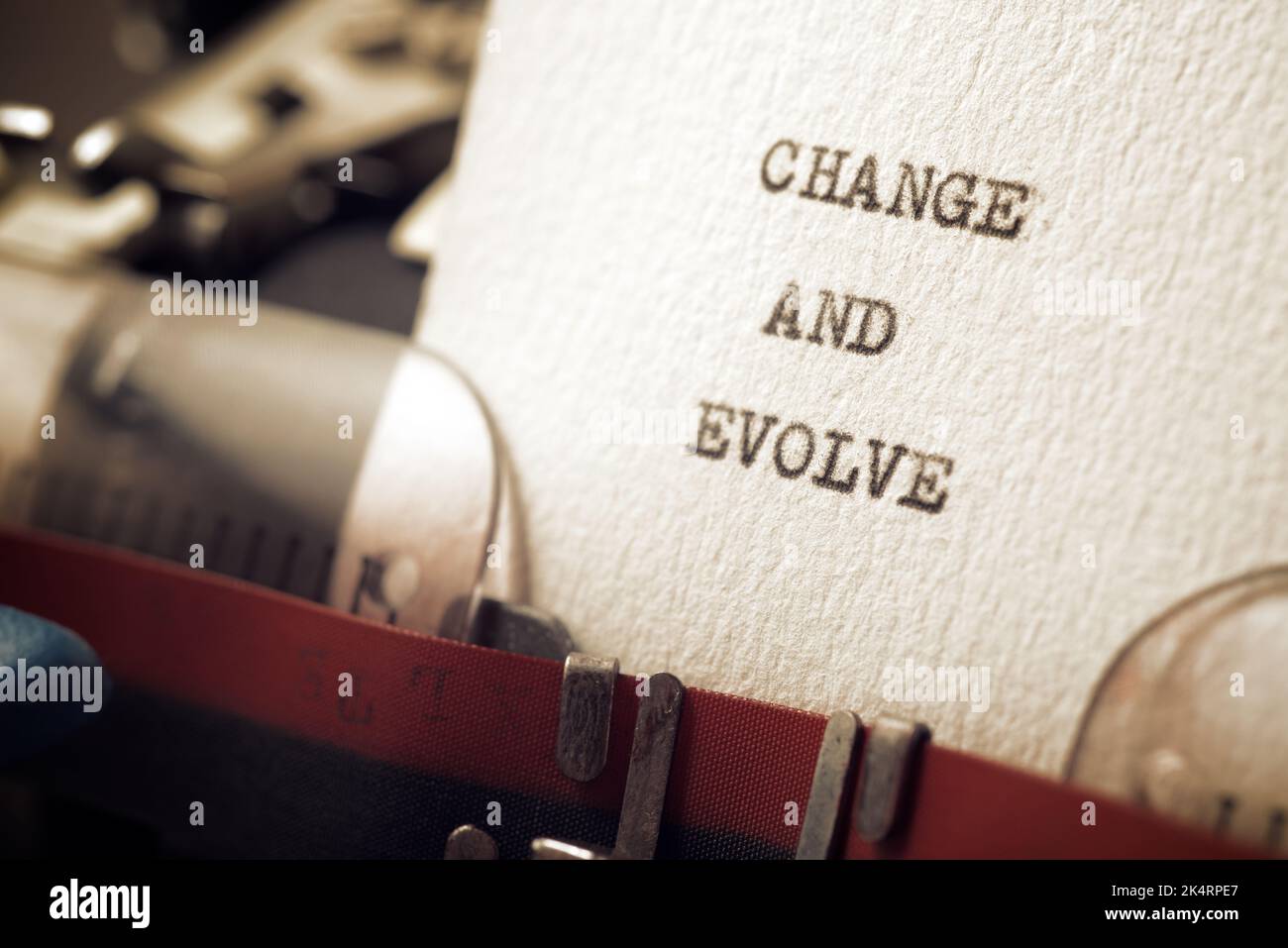 Change and evolve text written with a typewriter Stock Photo - Alamy
