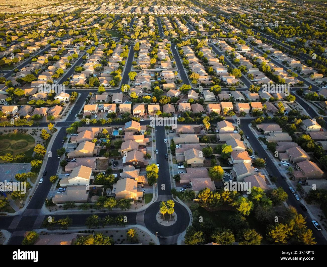 An aerial landscape of the suburb of a city at soft sunset Stock Photo ...