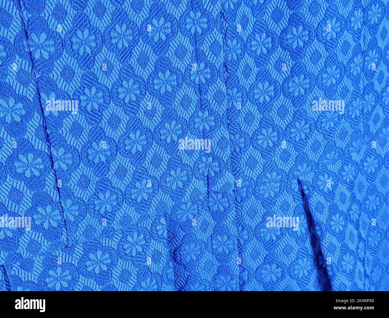 Blue fabric textile material with floral or rhomb pattern background ...