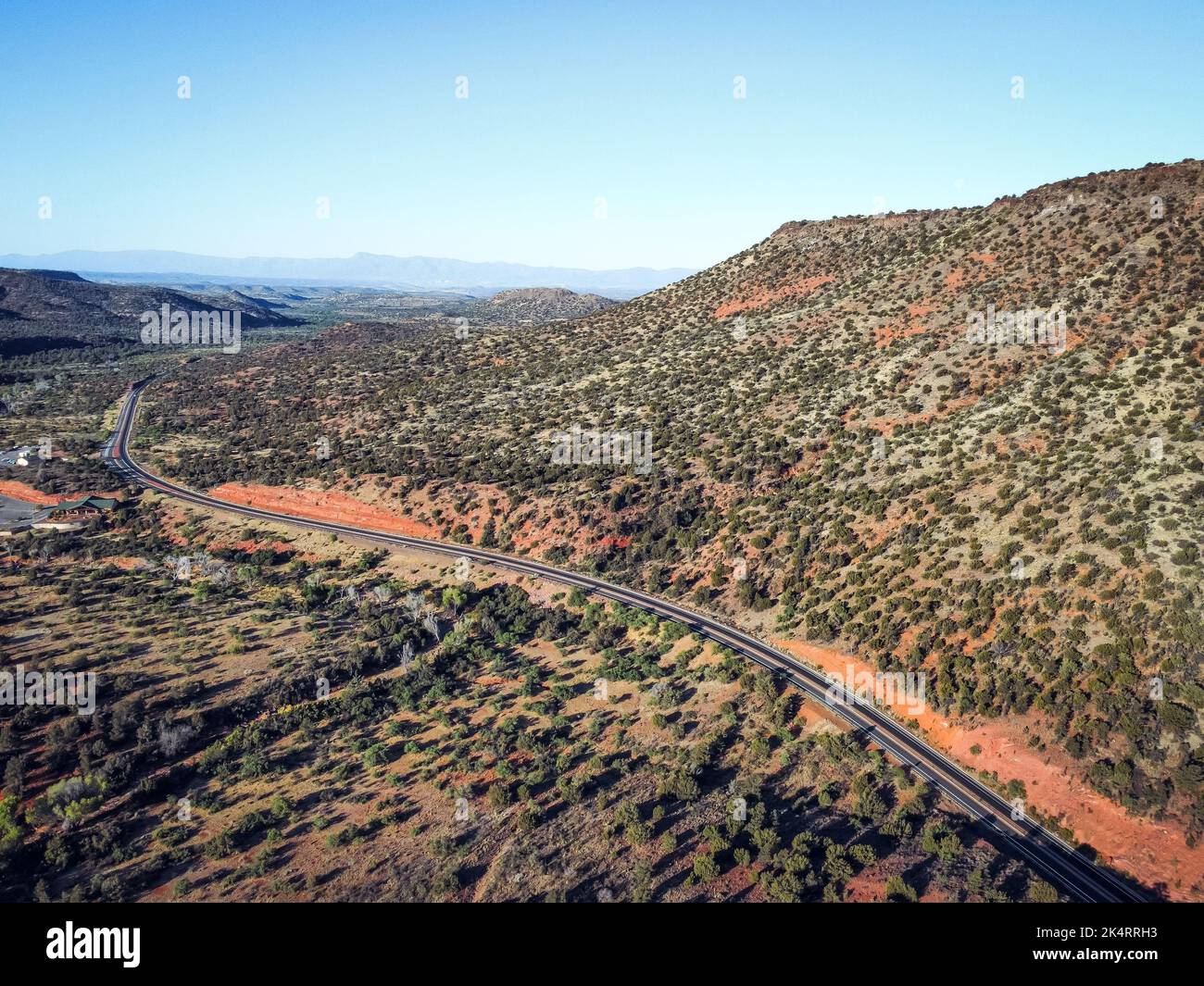 An aerial view of a highway stretching through the Arizona Desert Stock ...