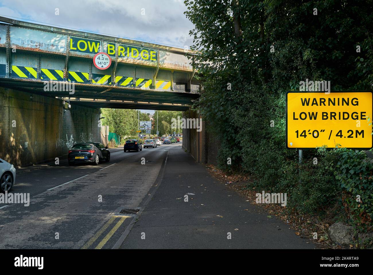 Warning, low railway bridge, Kettering, England Stock Photo - Alamy