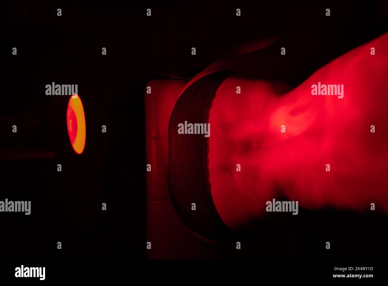 Woman with infrared Treatment back pain Stock Photo - Alamy