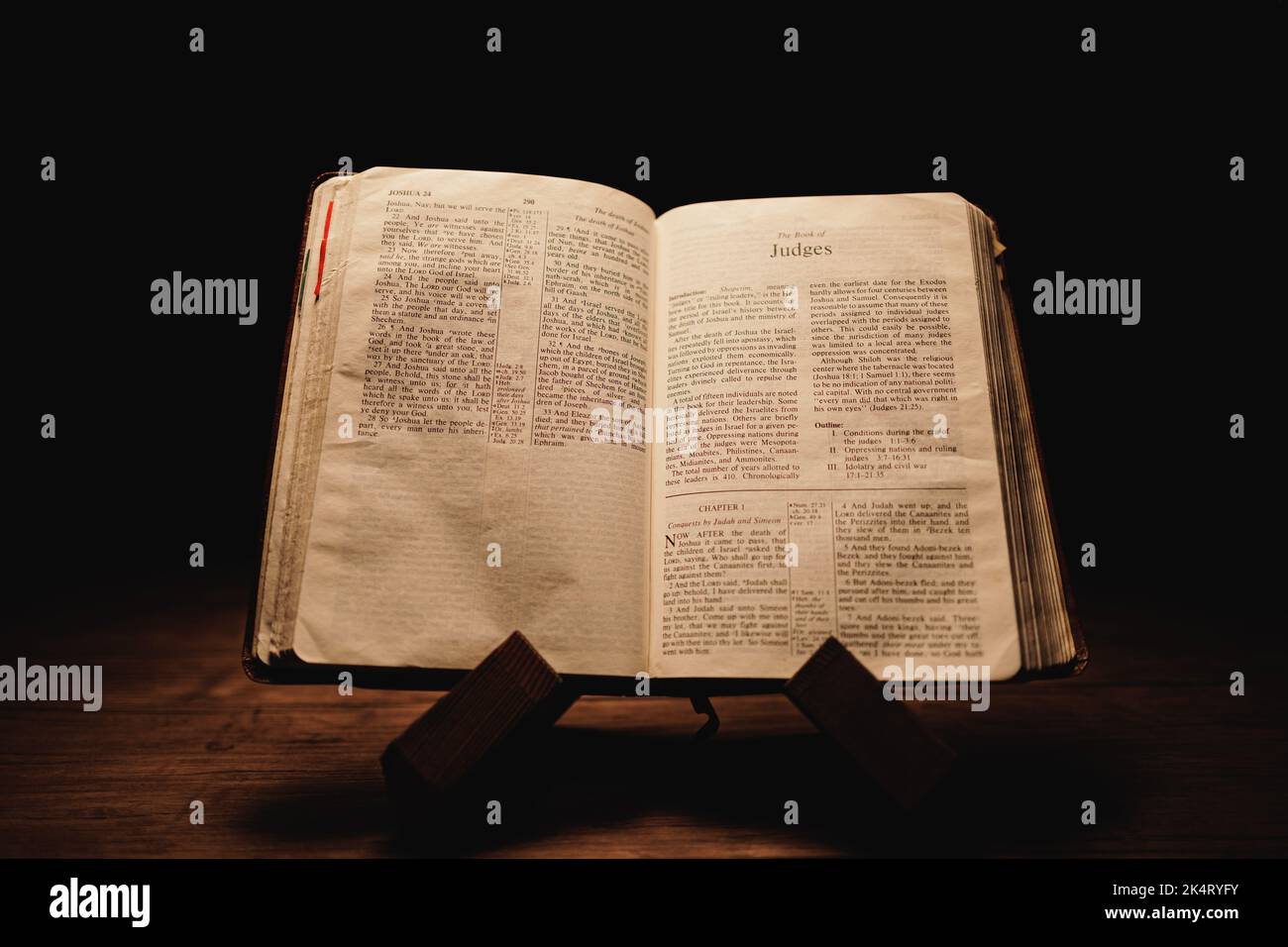 A closeup shot of a historic old Bible open on the Judges pages on ...