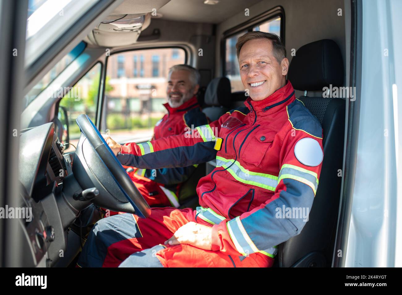 Paramedics posing for the camera in the medical emergency vehicle Stock ...