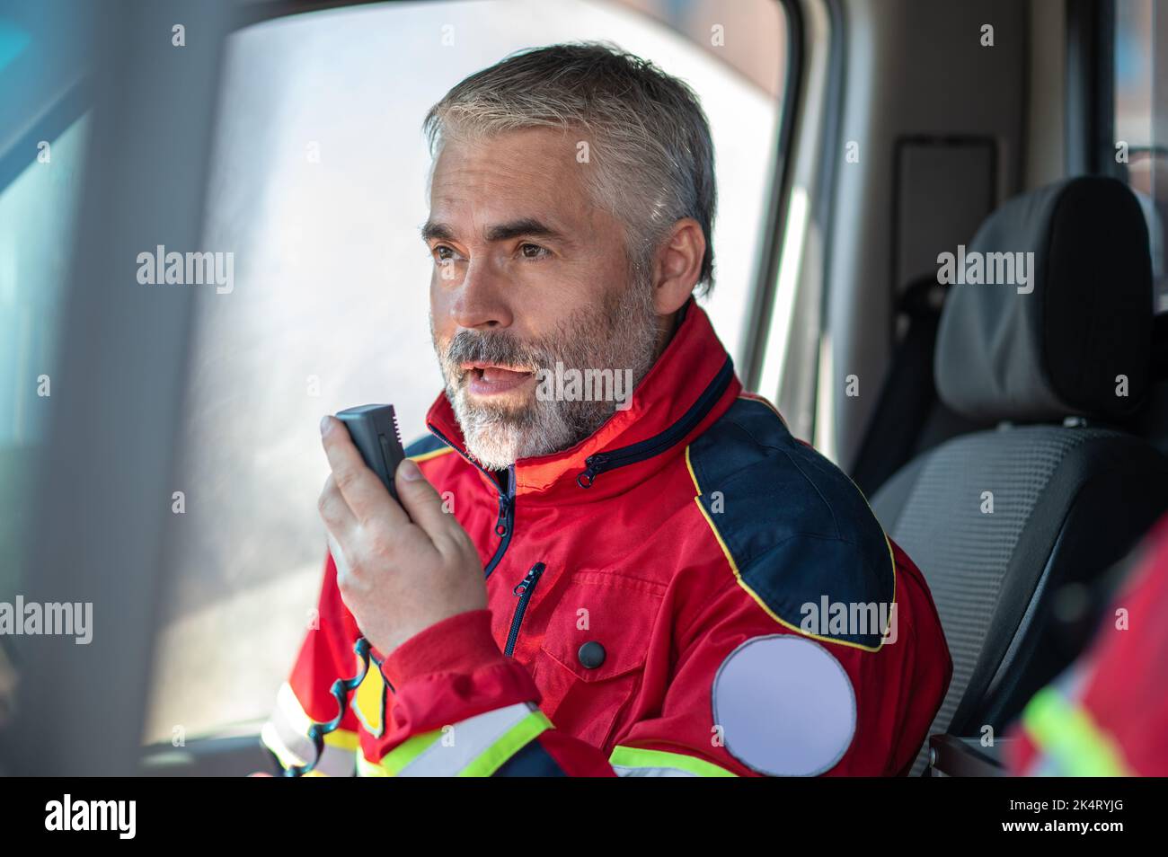 Paramedic professional riding in the ambulance car Stock Photo - Alamy