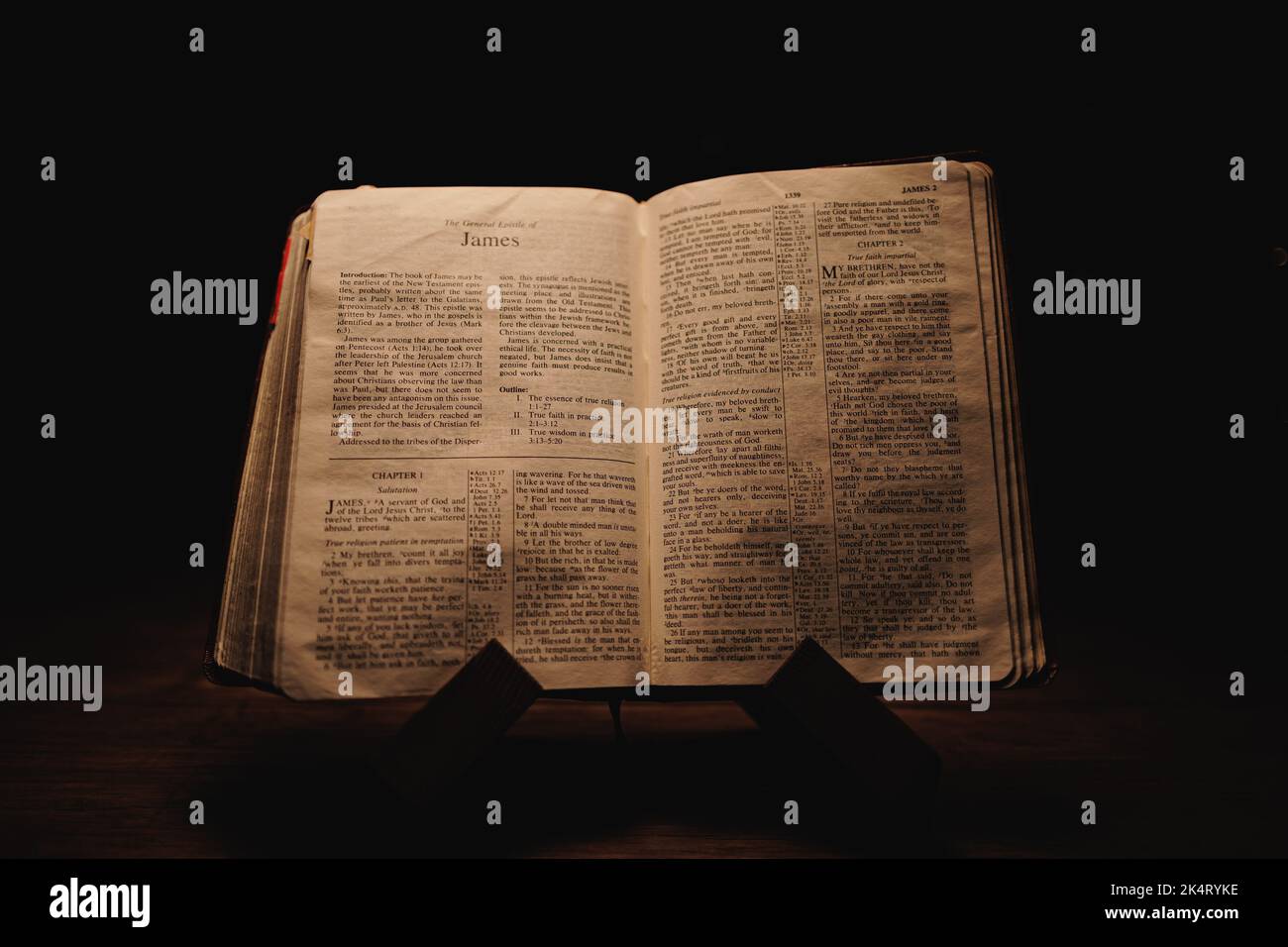 A closeup shot of a historic old Bible open on the James pages on ...