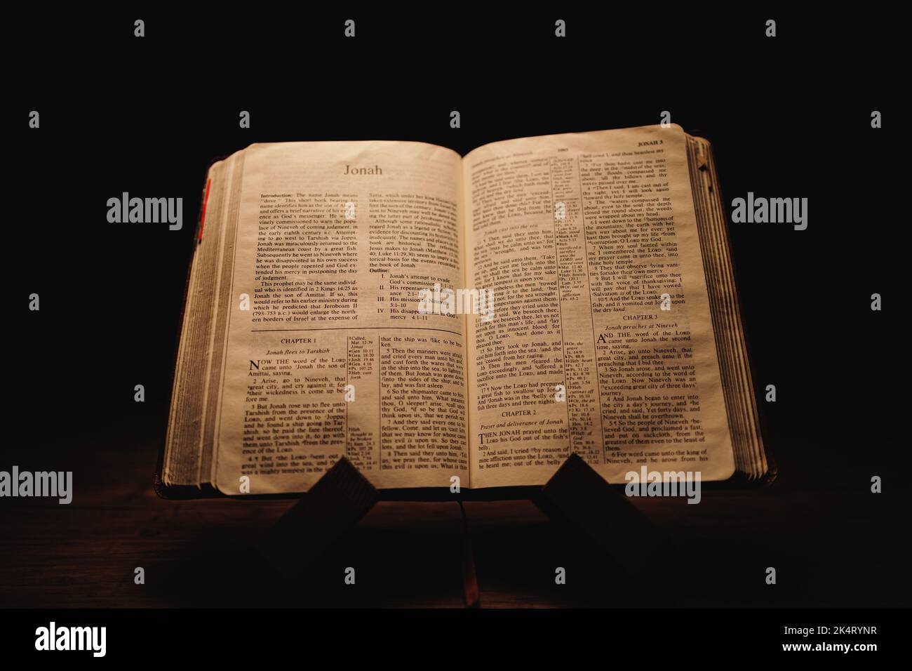 A closeup shot of a historic old Bible open on the Jonah pages on ...