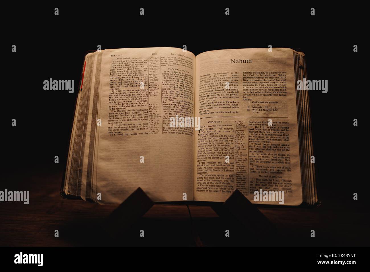 A closeup shot of a historic old Bible open on the Nahum pages on ...