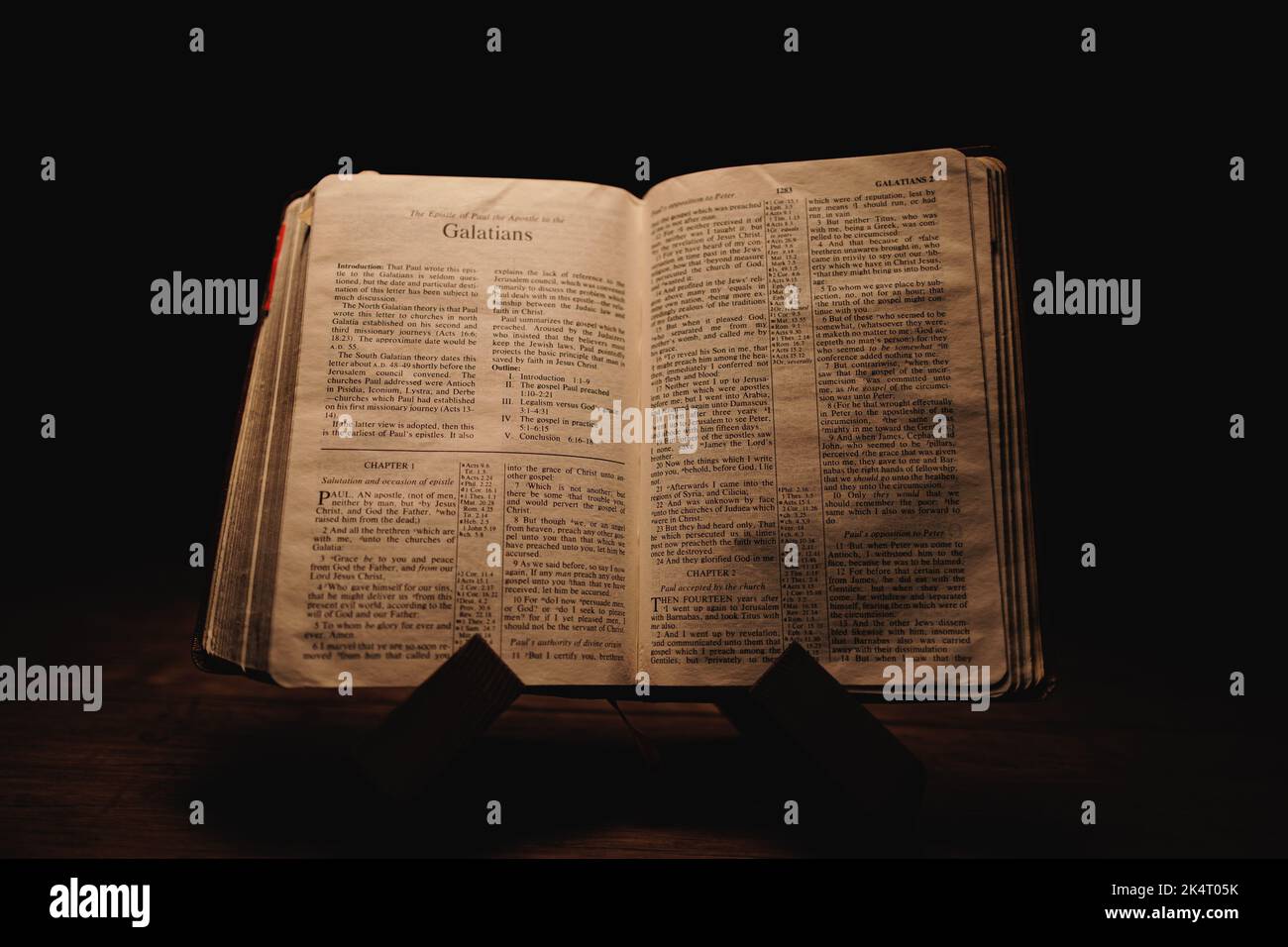 A closeup shot of a historic old Bible open on the Galatians pages on ...