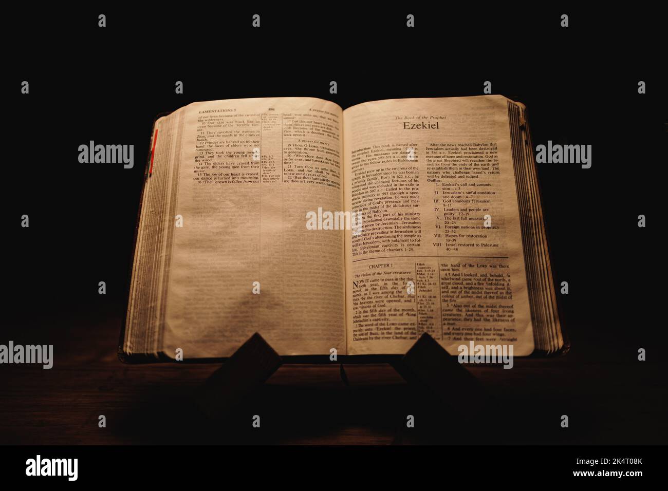 A closeup shot of a historic old Bible open on the Ezekiel pages on ...