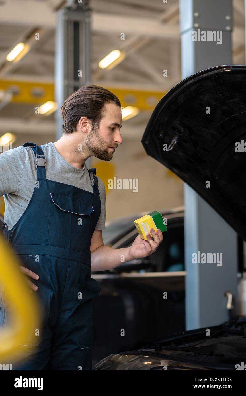 Car technician working at the service station Stock Photo - Alamy