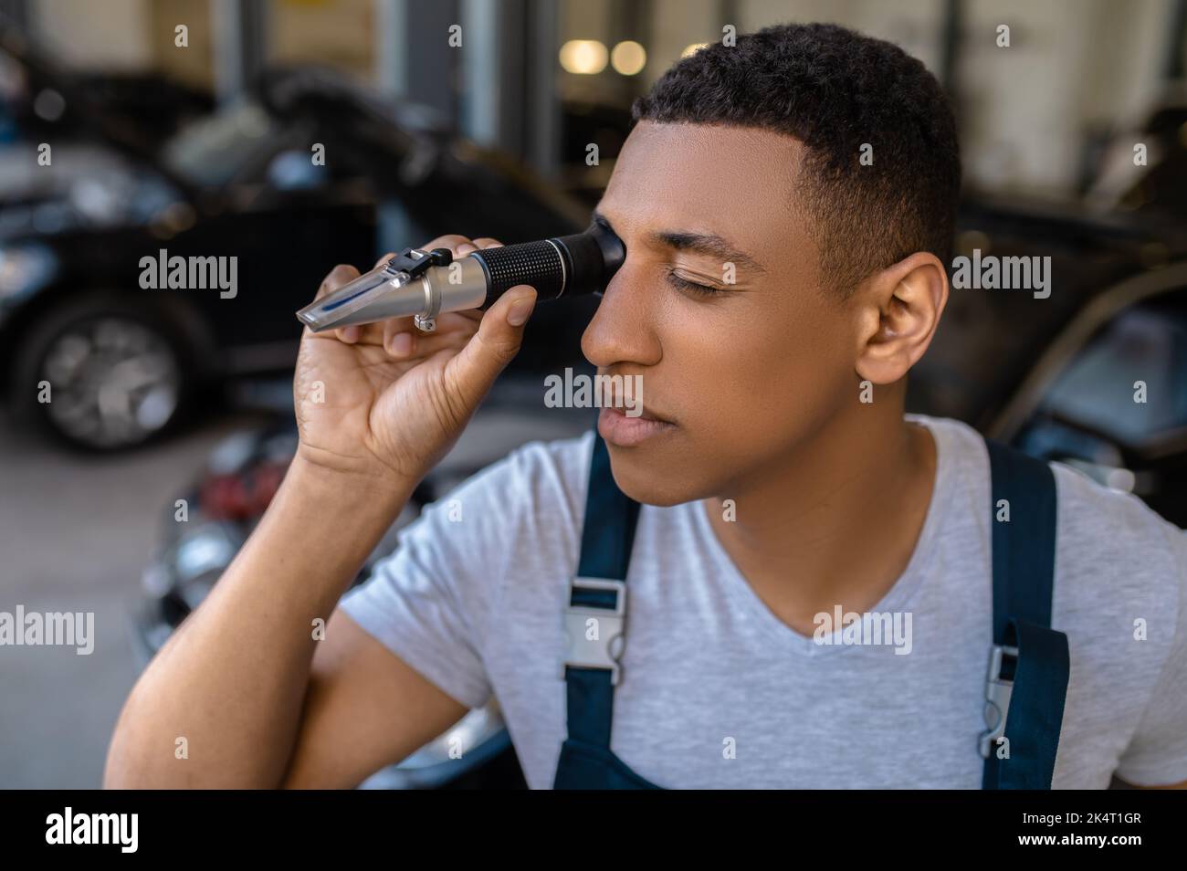 Automotive technician working at the car service station Stock Photo ...