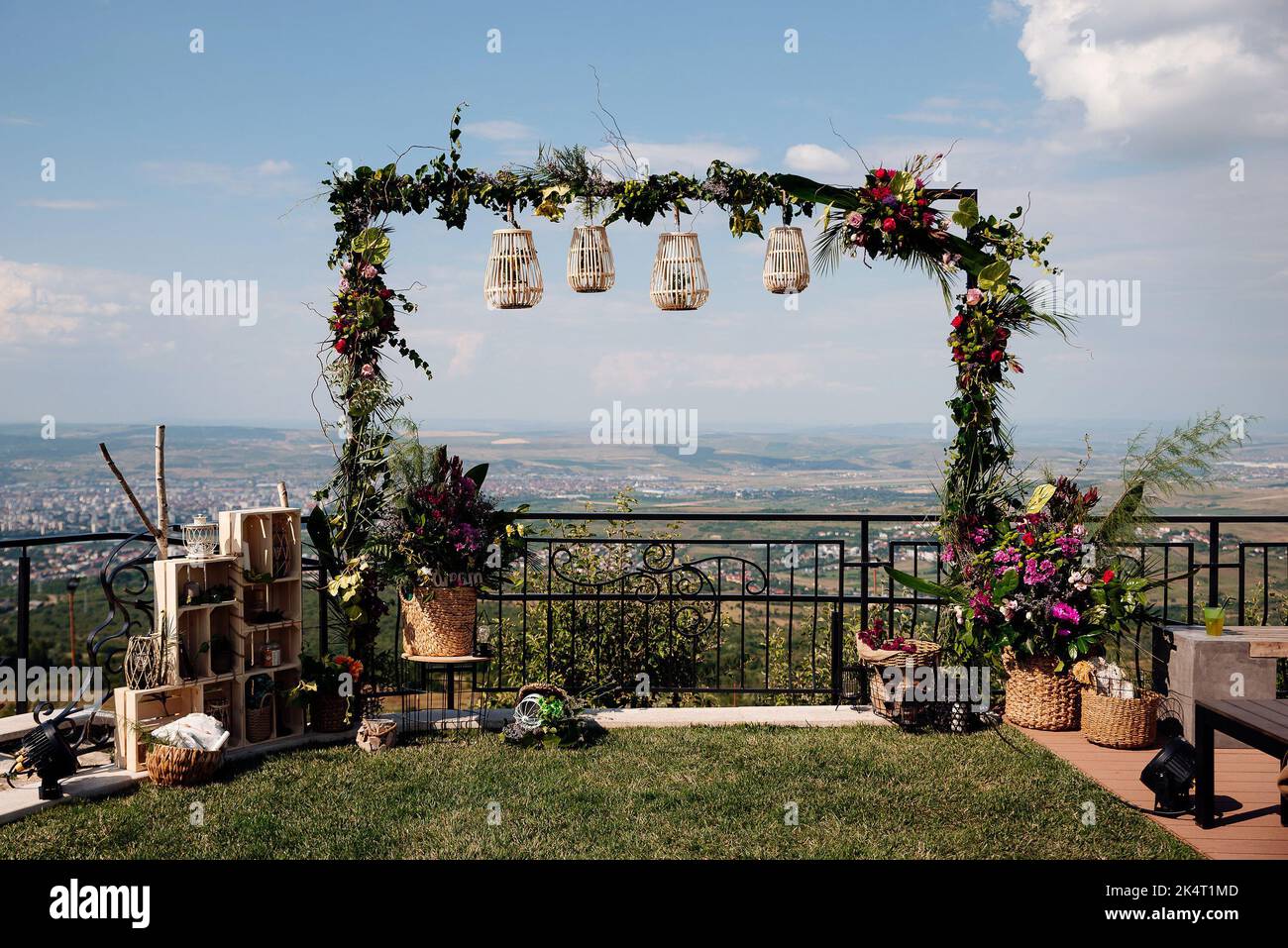 A decoration with bird cages and plants in the balcony for a summer ...