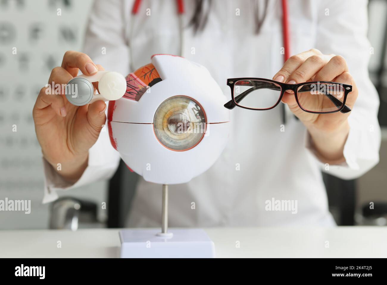 Optometrist woman holding glasses hi-res stock photography and images ...