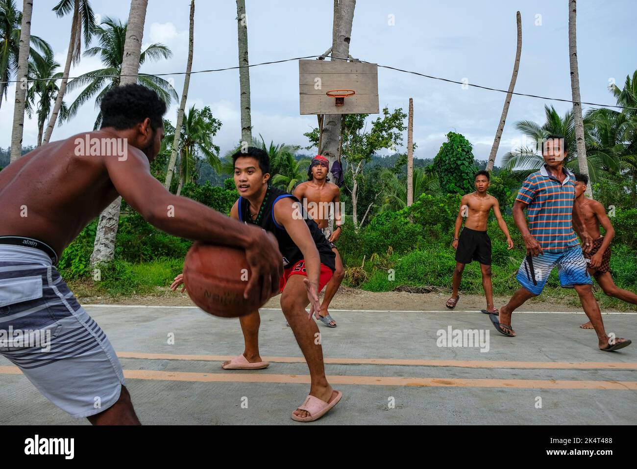 Port Barton, Philippines - May 2022: People playing basketball in the ...