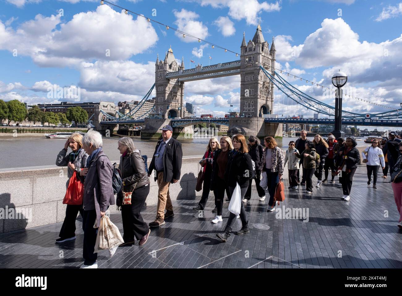 Long queues of people at Tower Bridge wait patiently in line to see ...