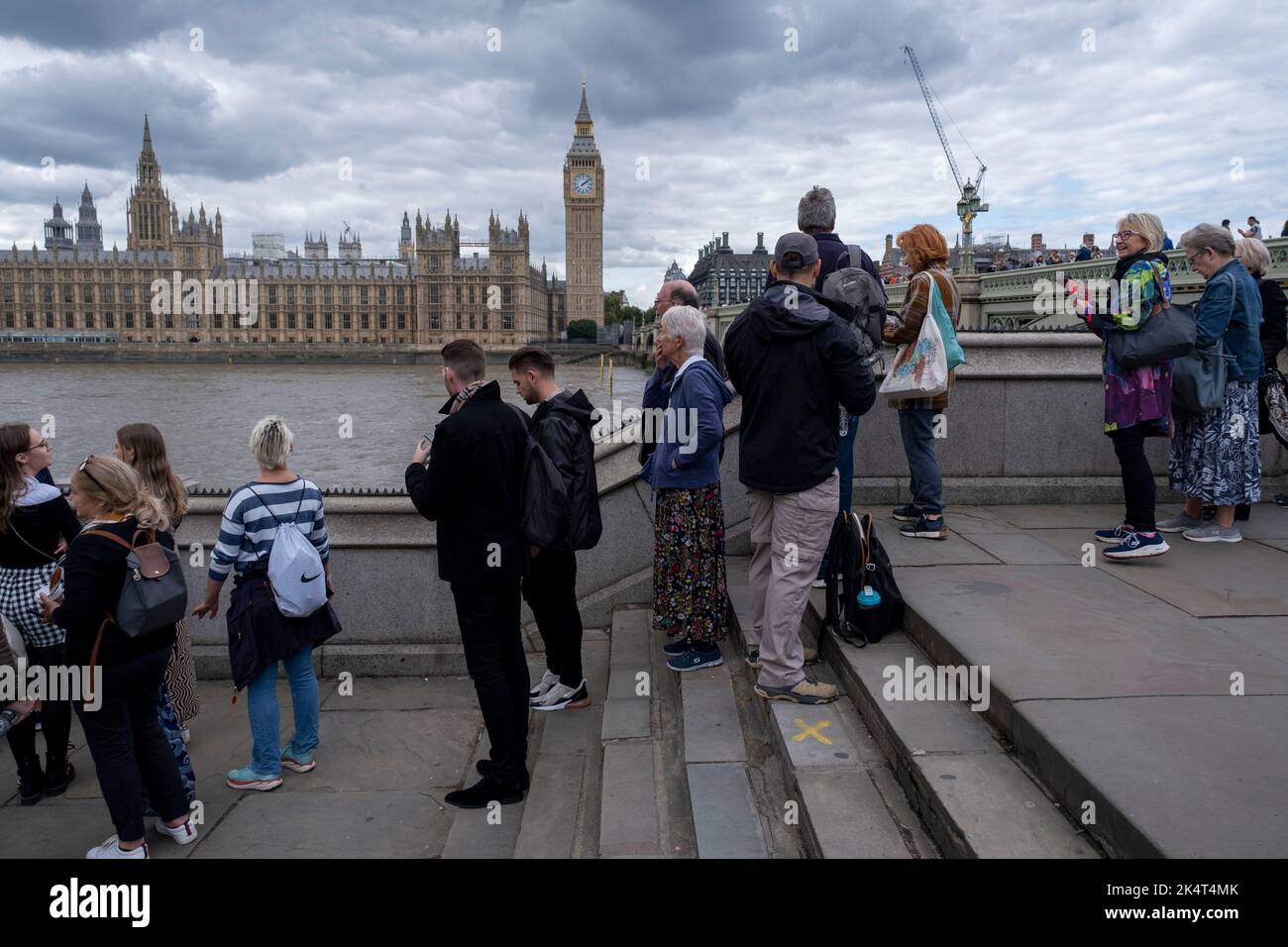 Long queues of people on the riverside walkway opposite the Houses of ...