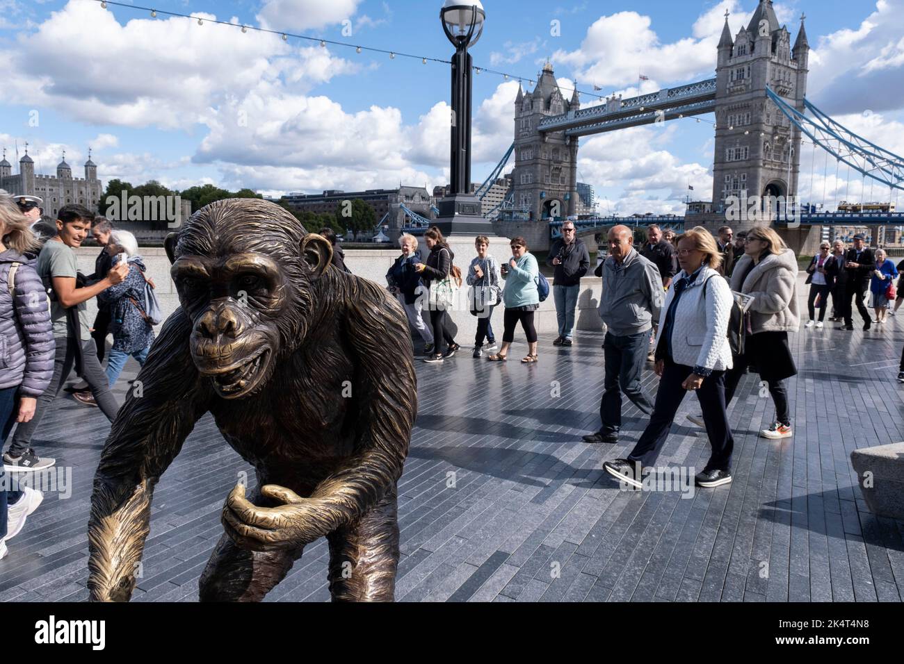 Public art chimpanzee sculpture as long queues of people at Tower ...