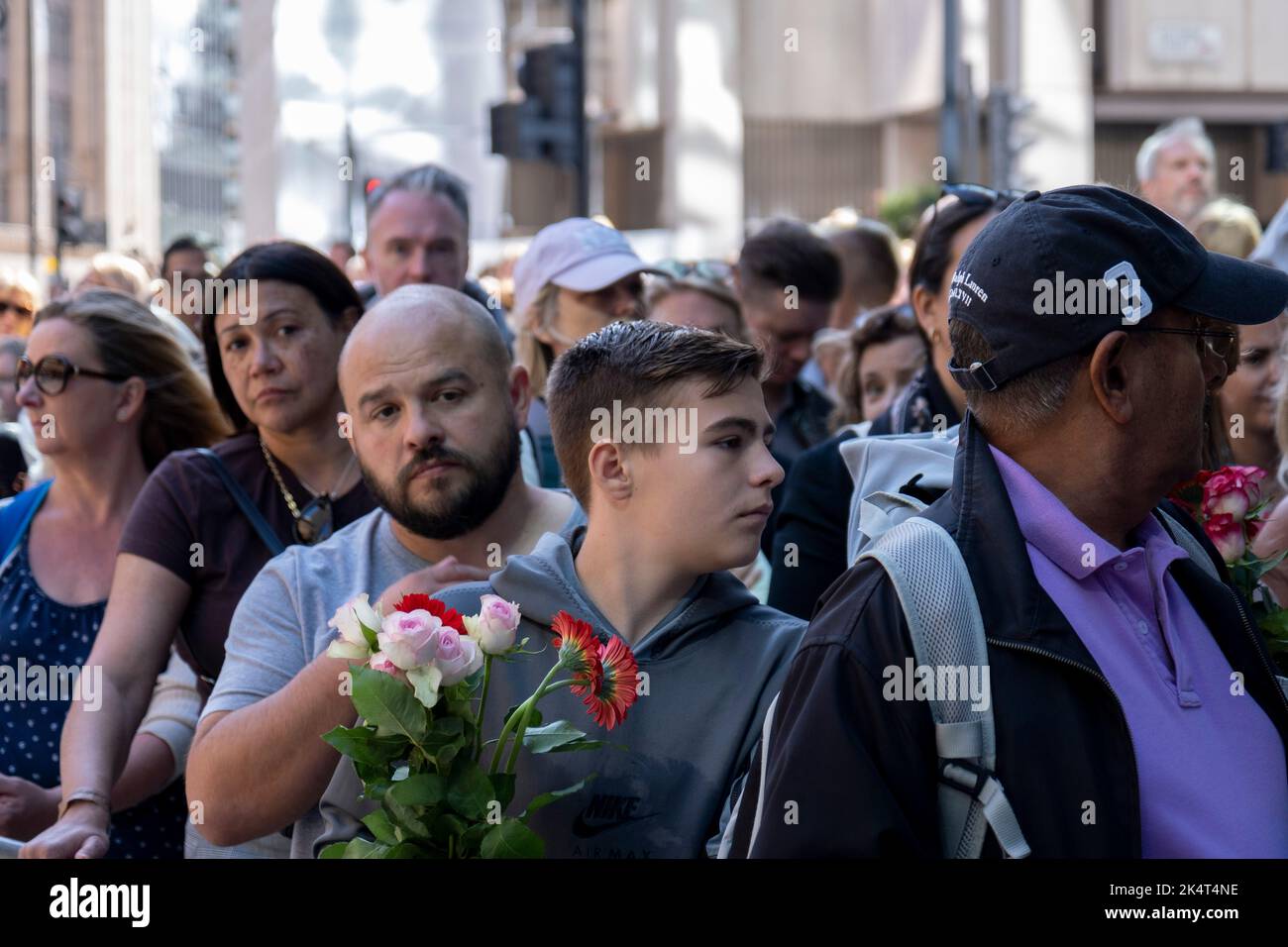 Long queue of people wait in line to leave flowers in Green Park as ...