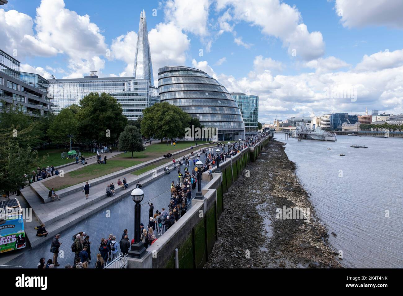 Long queues of people at More London wait patiently in line to see ...