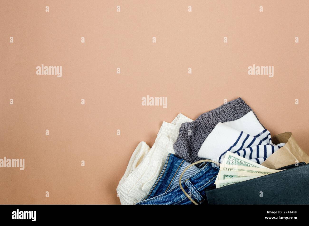 craft paper bag with full of used clothing for recycling or donation ...