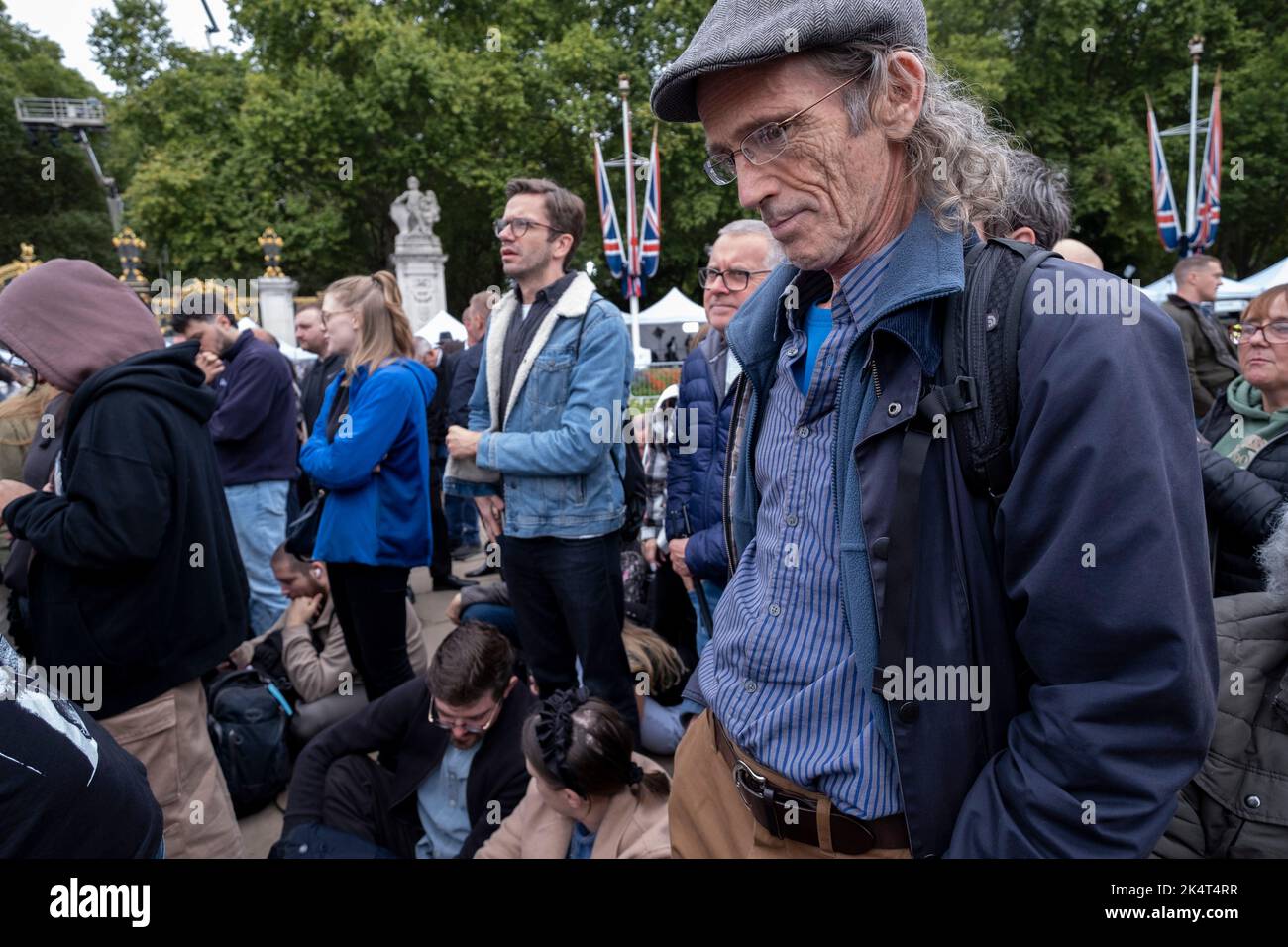 Members of the public sit and stand waiting for hours for the at the ...