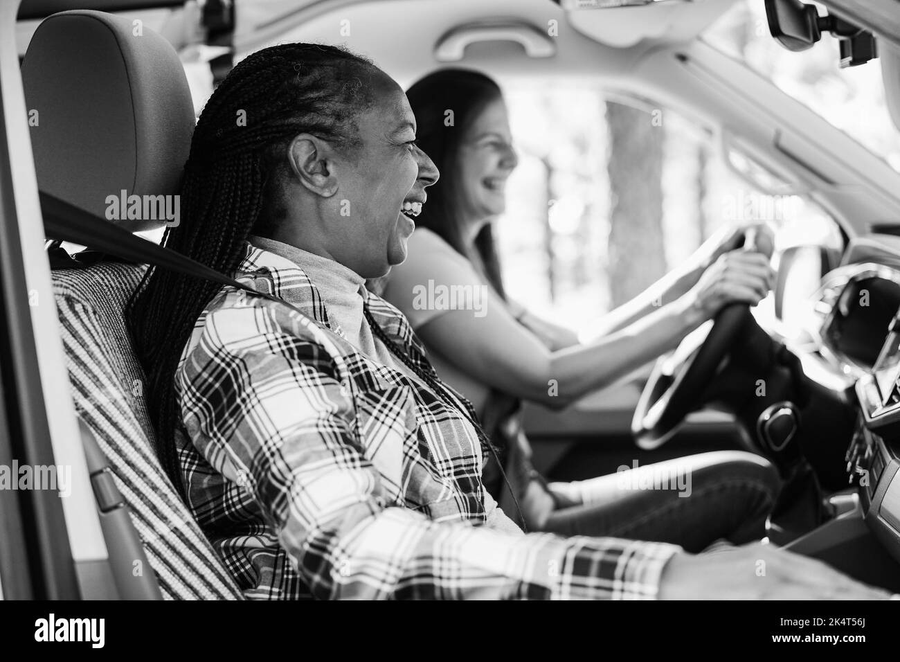 Multiracial senior female having fun on the road in camper van - Focus ...