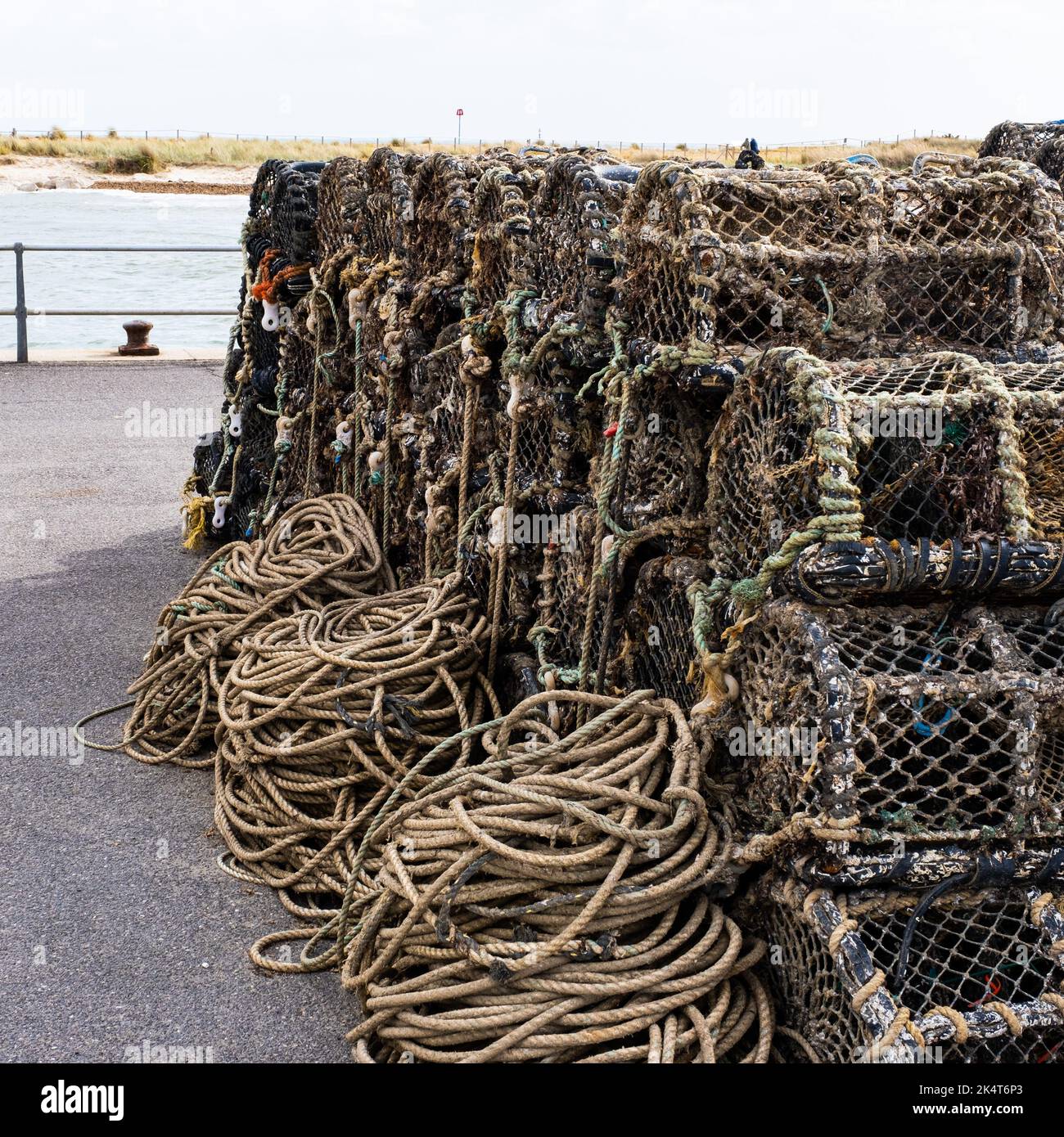 Lobster pots and ropes on the quayside at Mudeford, Hampshire Stock ...