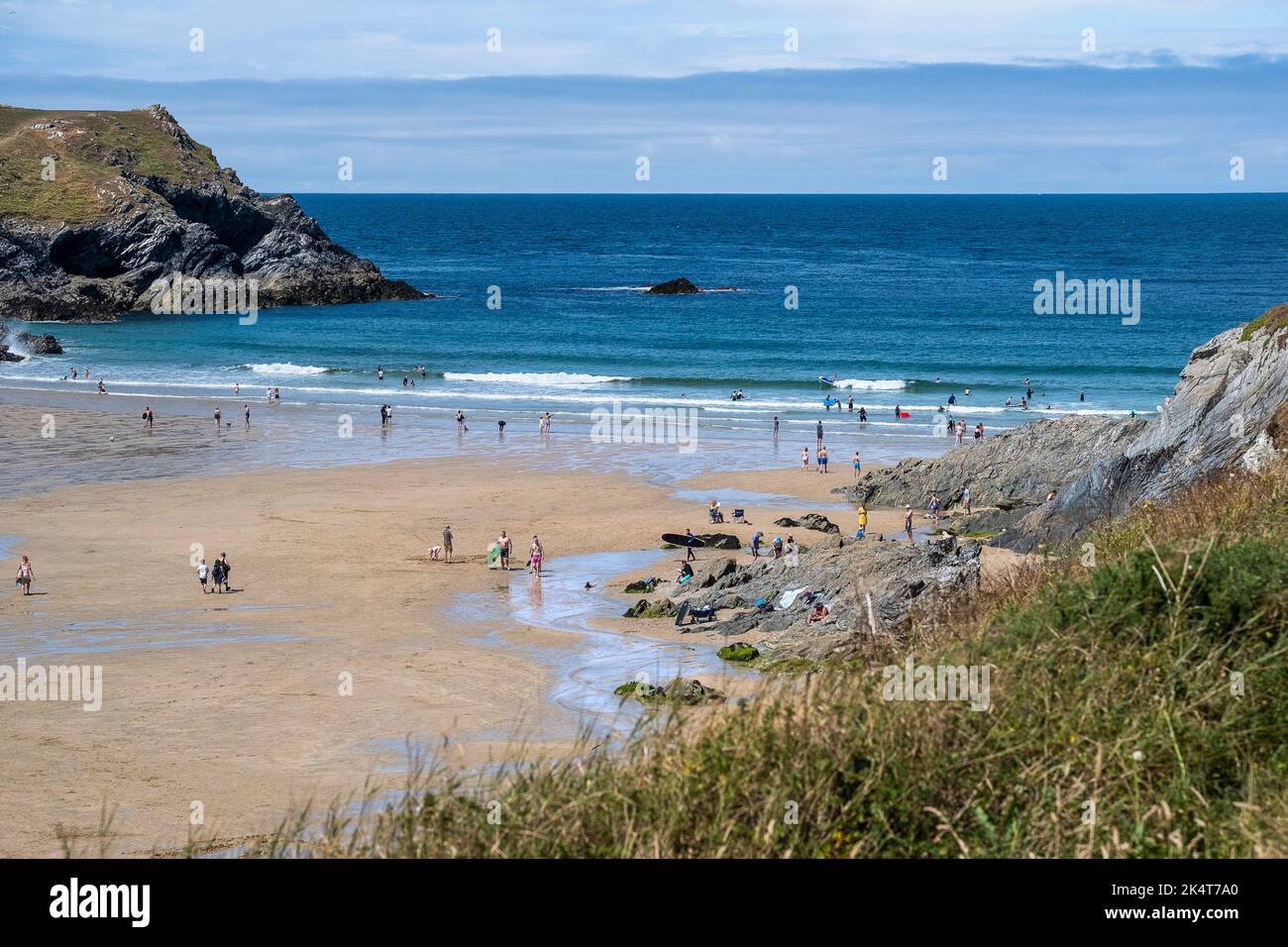 Holidaymakers relaxing on the beach at Polly Porth Joke on the coast at ...
