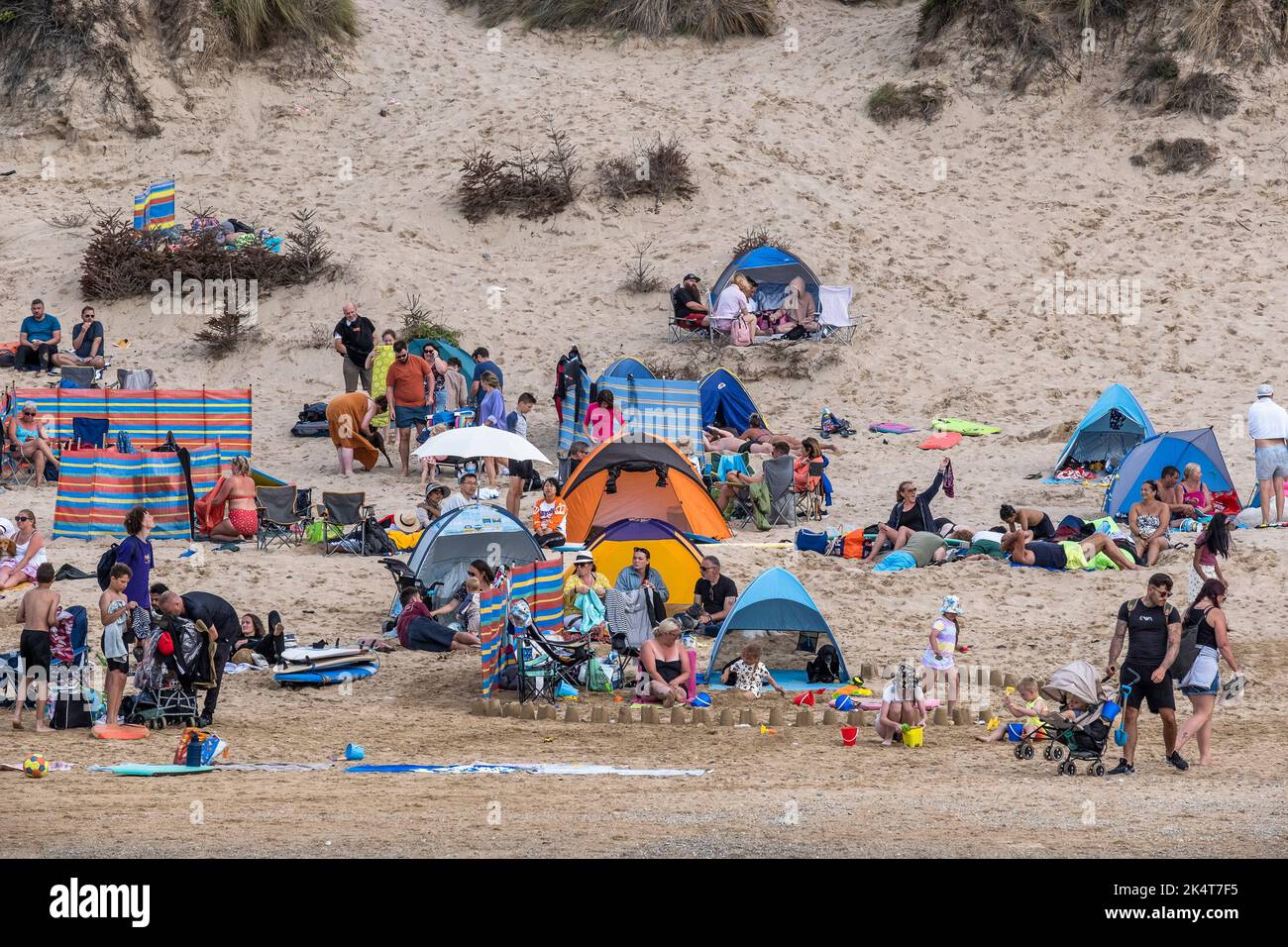 Holidaymakers on a busy Fistral Beach in Newquay in Cornwall in the UK ...