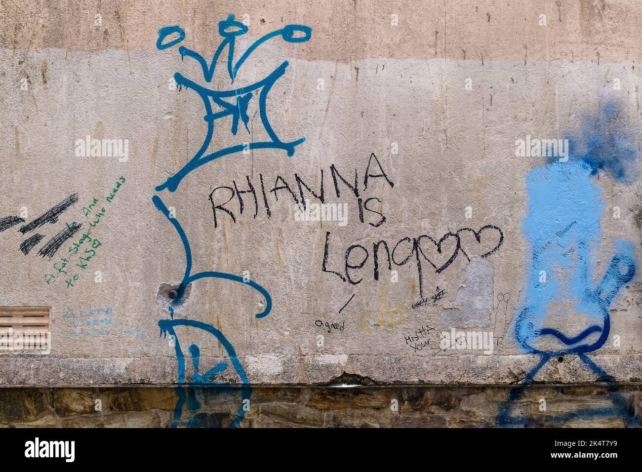 Insulting; graffiti scrawled over a wall in Roberts Ope an old alleyway ...